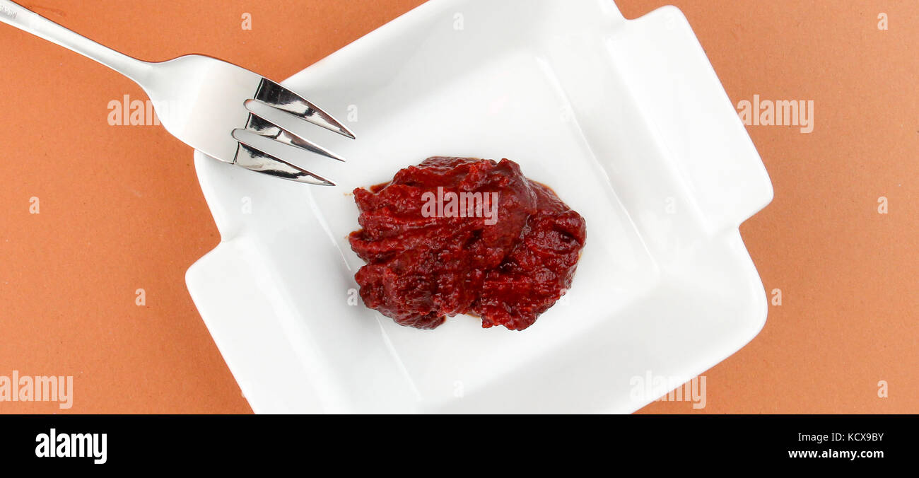 picture of a Tomato paste in small white dish Stock Photo - Alamy