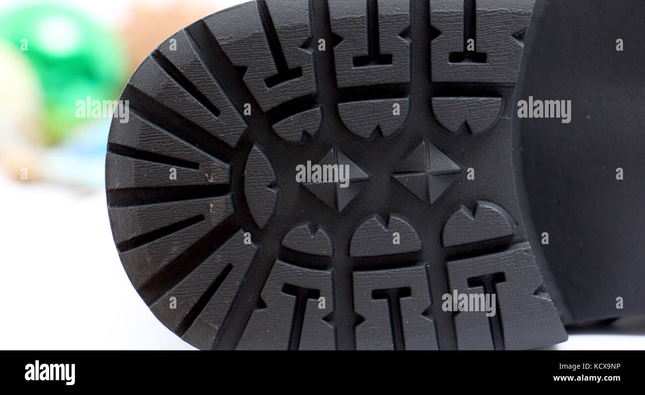 picture of a Bottom of a men's black winter boot, patterns and texture ...