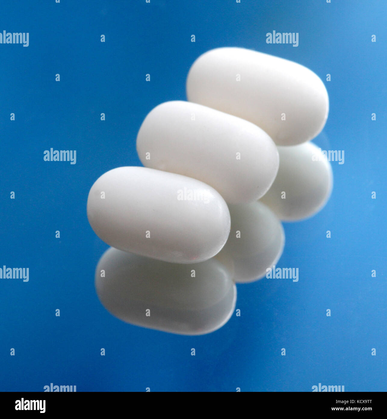 picture of a capsule like white sweet candy,mint taste Stock Photo - Alamy