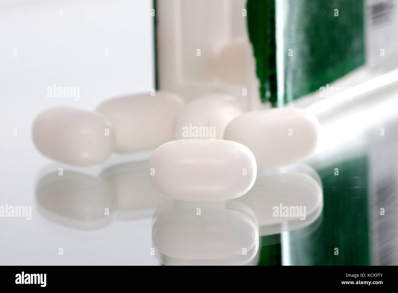 picture of a capsule like white sweet candy,mint taste Stock Photo - Alamy