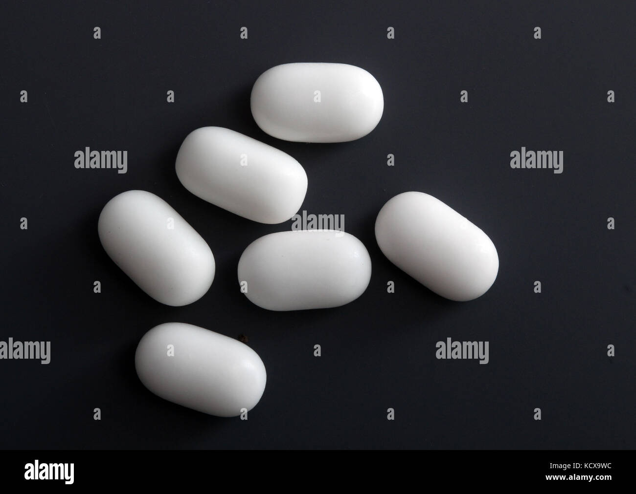 picture of a capsule like white sweet candy,mint taste Stock Photo - Alamy