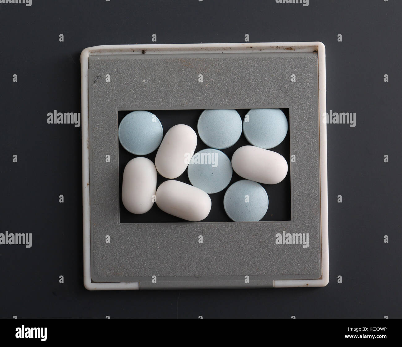 picture of white candies and blue pills, sweet and bitter Stock Photo ...