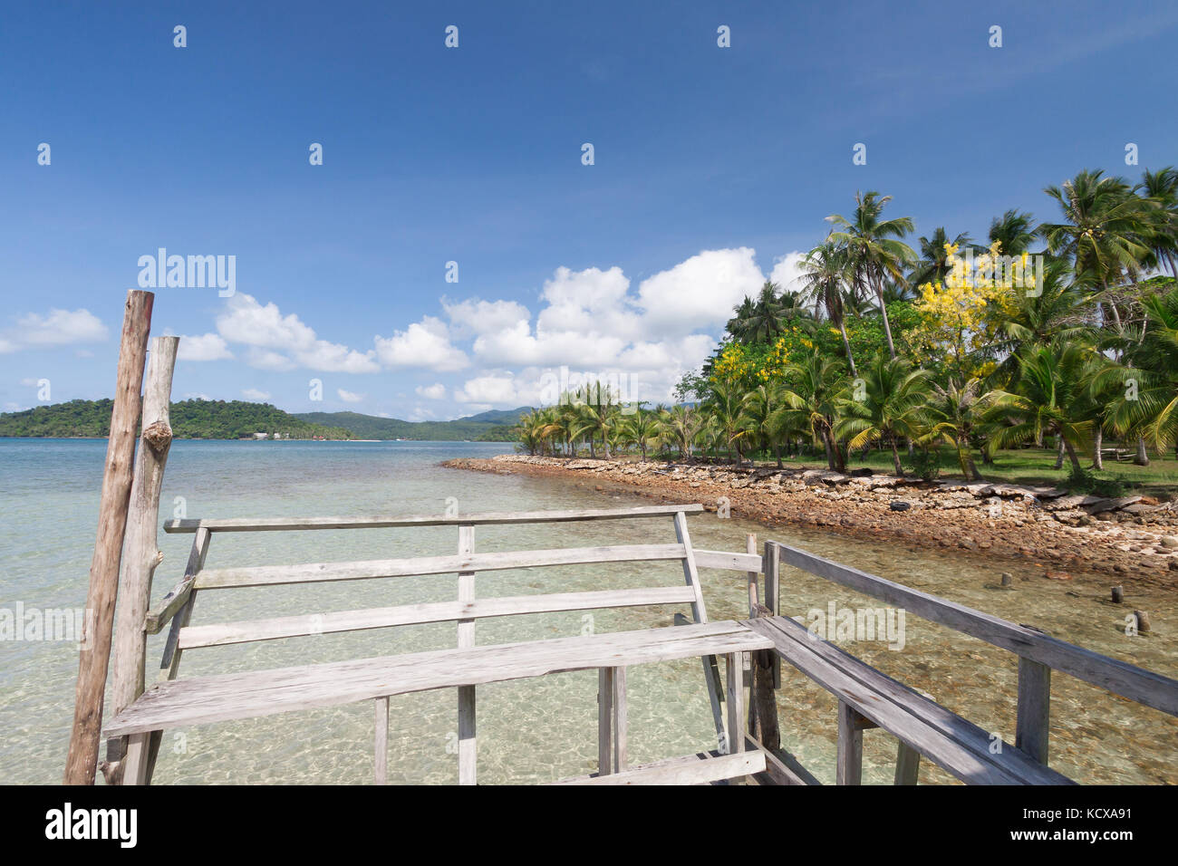 Wooden bench with tropical sea Stock Photo - Alamy