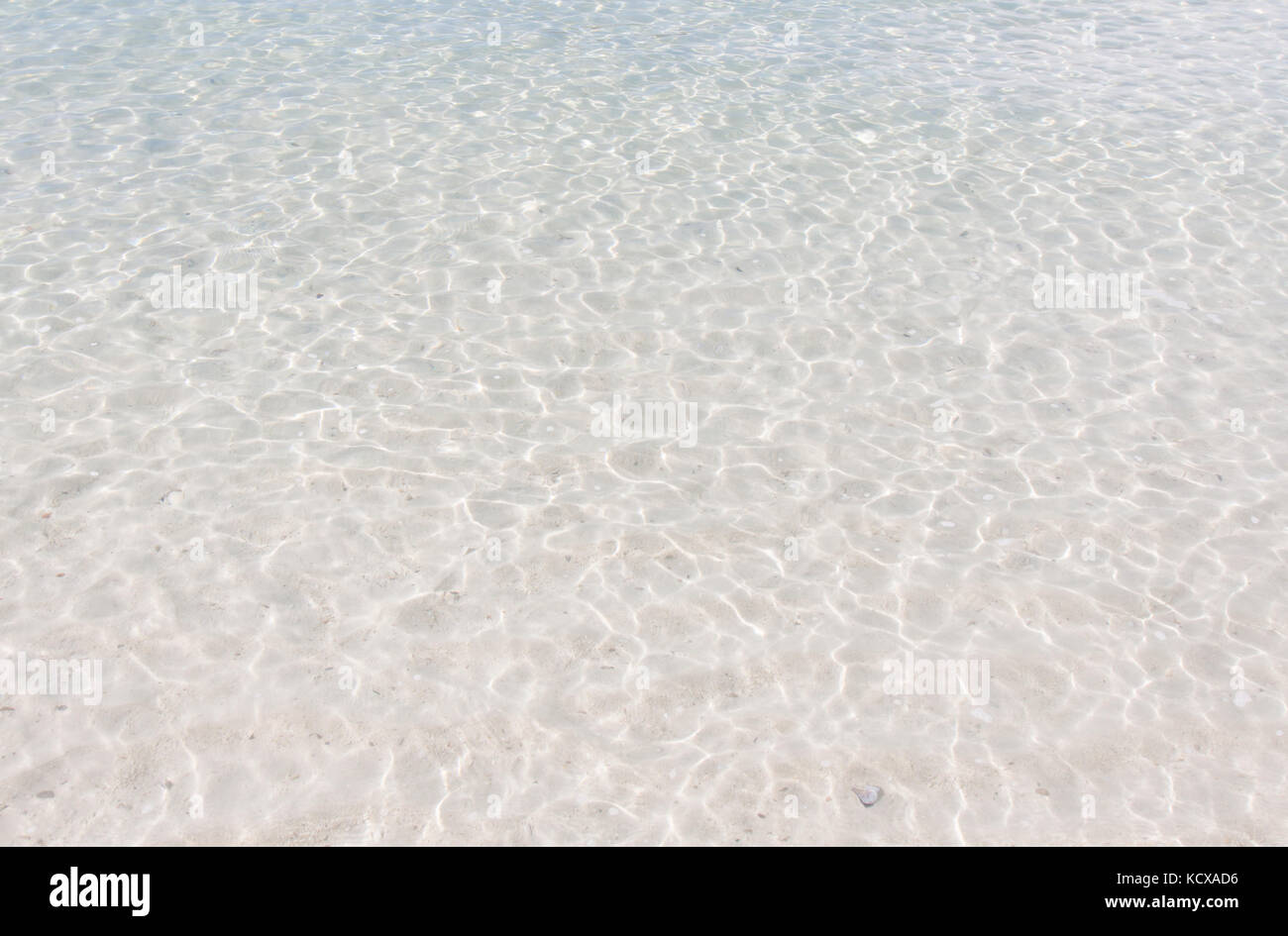 Clear water surface with white sand Stock Photo - Alamy