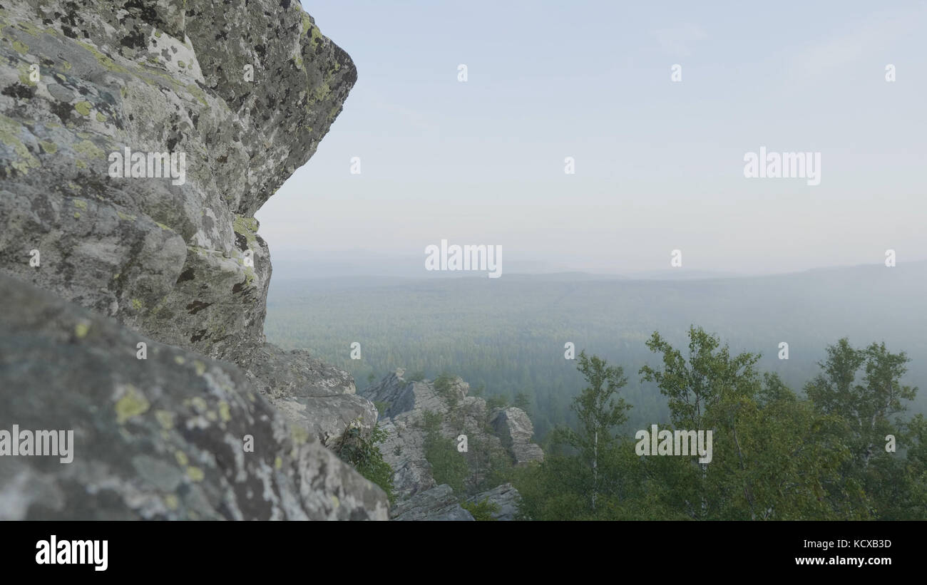 Outdoor natural landscape perspective. Massive rocks and view to the ...