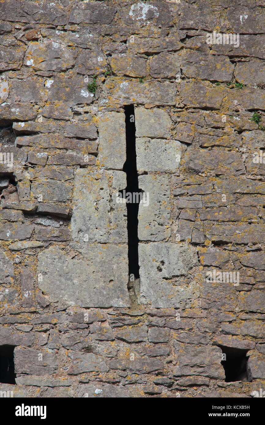 A very accurately cut Archers slot in the side of a ruined castle ...