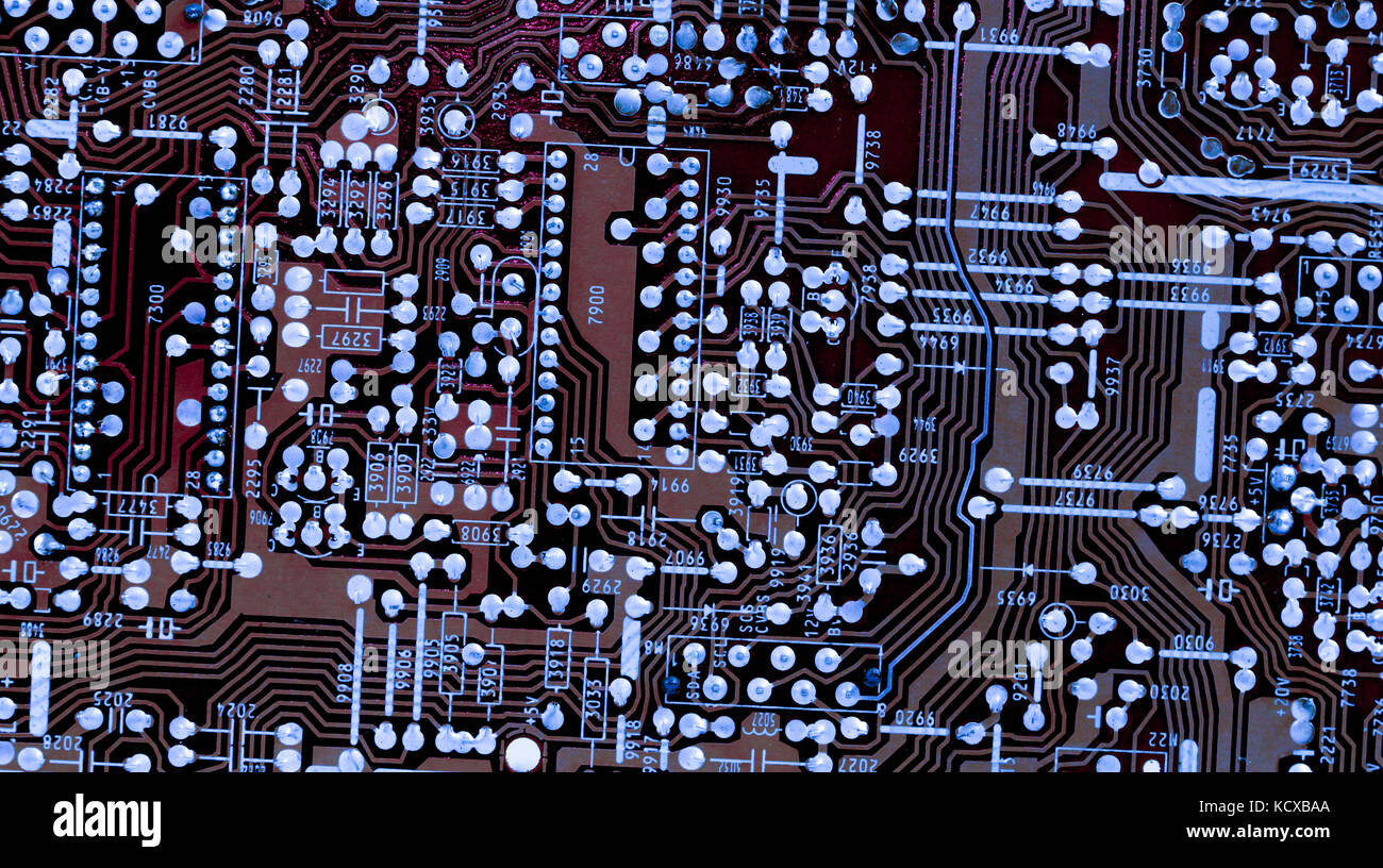 Part of old vintage printed circuit board with electronic components ...