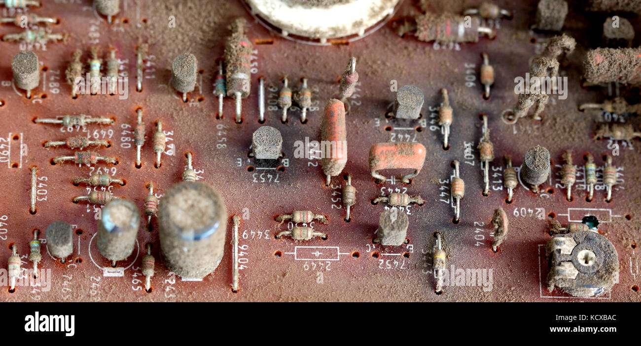 Part of old vintage printed circuit board with electronic components ...