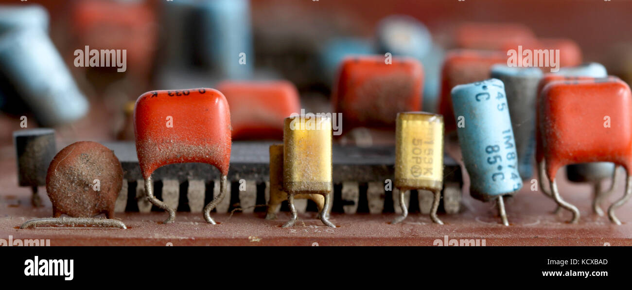 Part of old vintage printed circuit board with electronic components ...