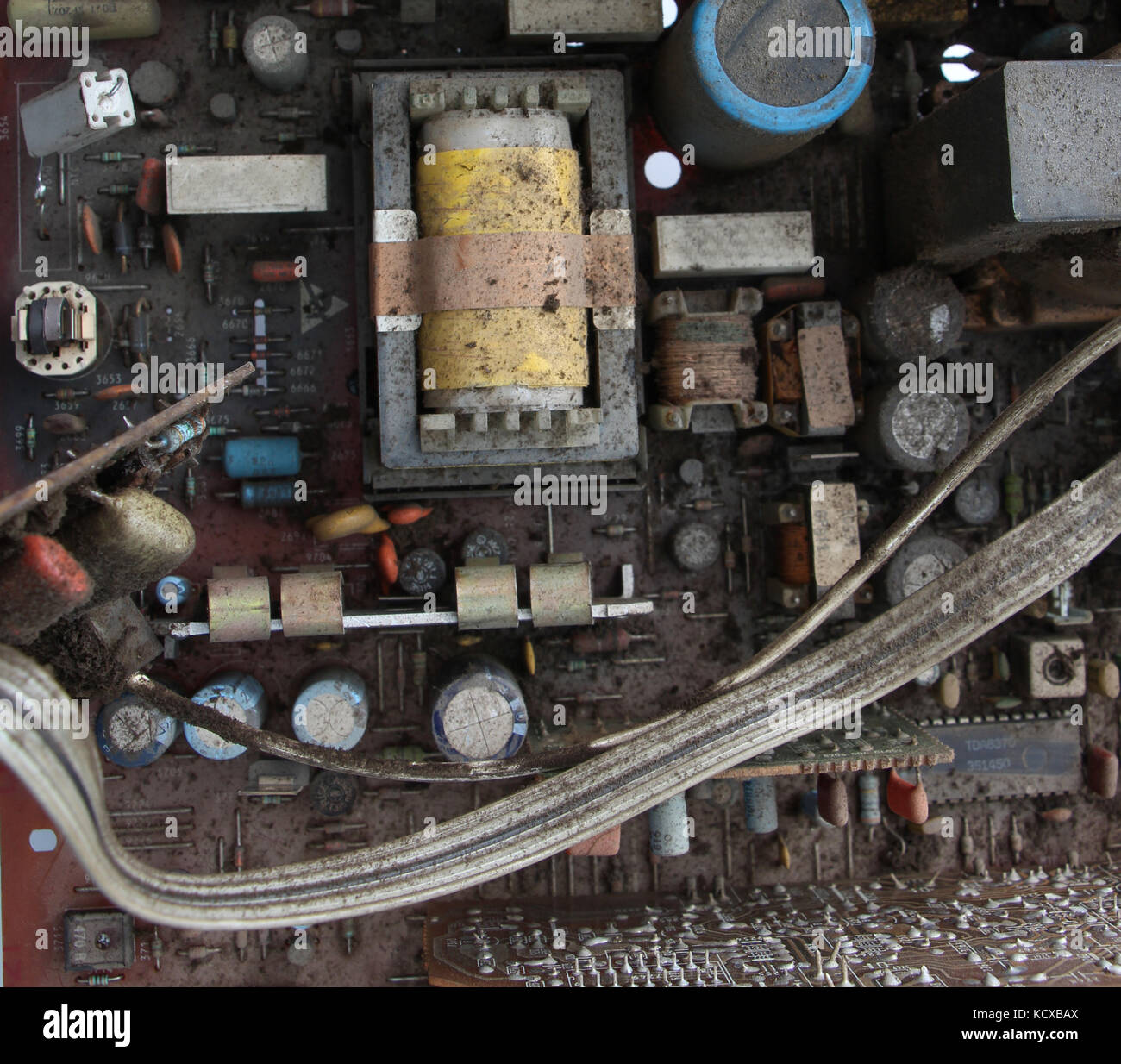 Part of old vintage printed circuit board with electronic components ...