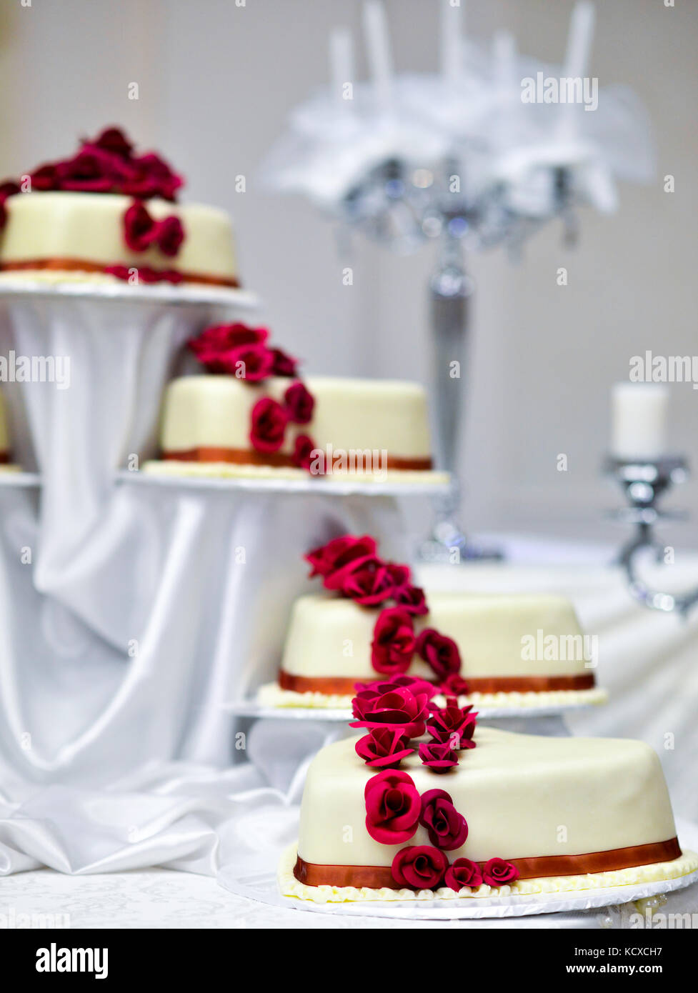 White Wedding Cake With Red Roses
