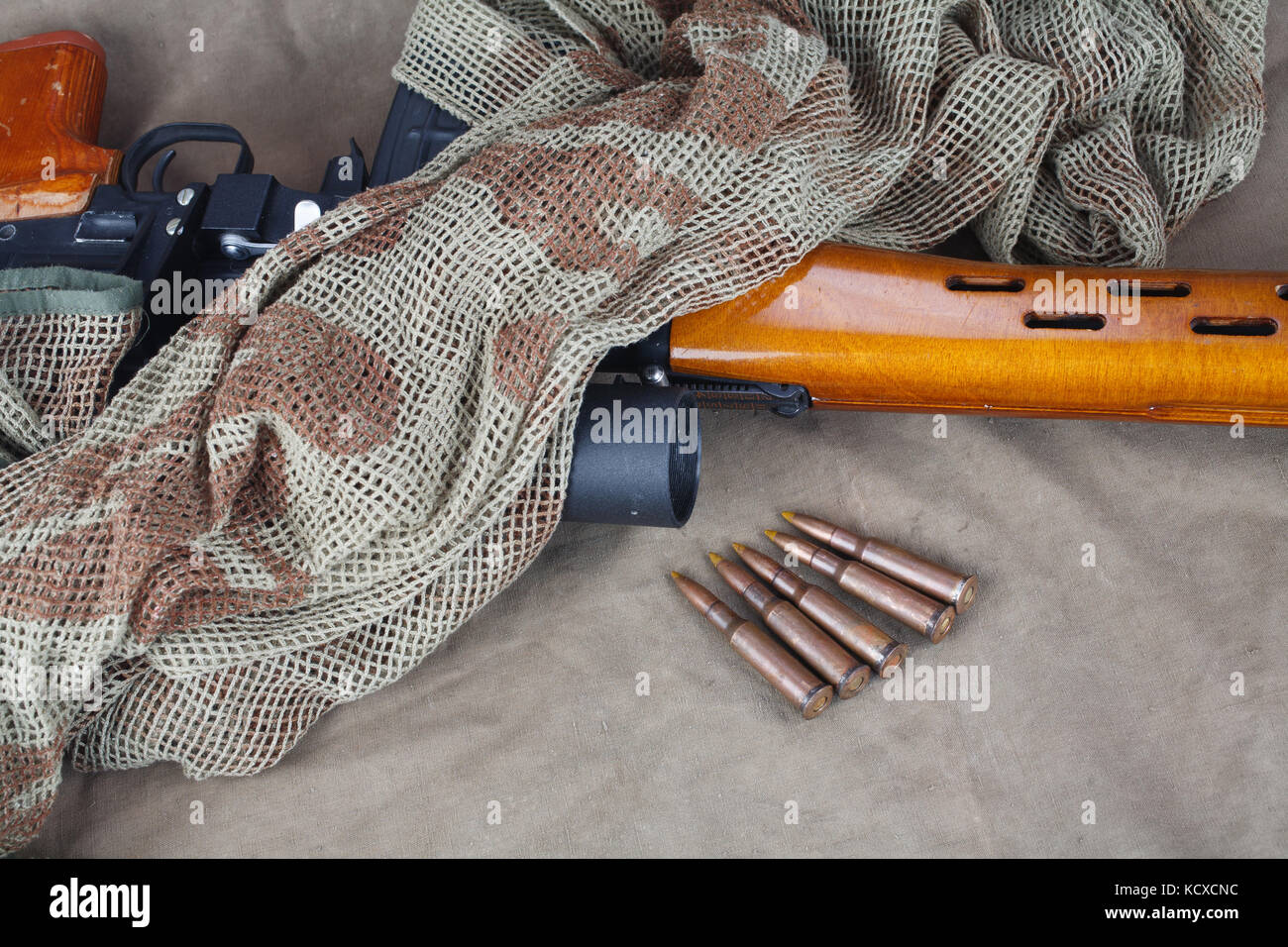 SVD sniper rifle on khaki canvas background Stock Photo - Alamy