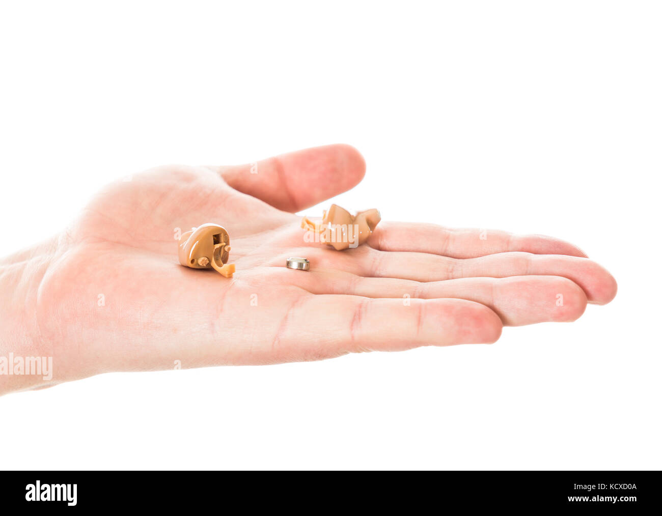 Hand holding hearing aid Stock Photo - Alamy