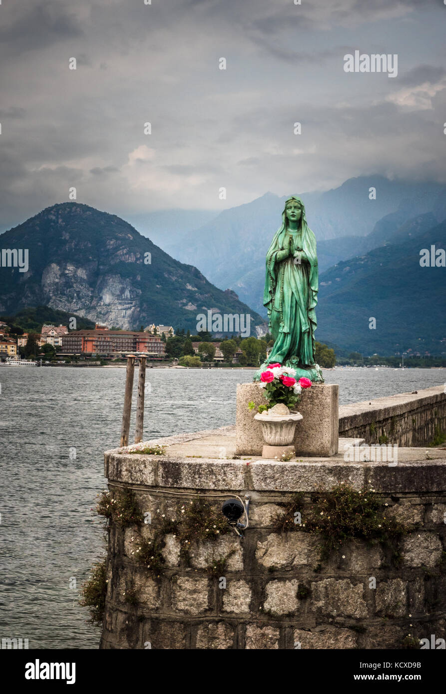 Statue of Madonna on harbour entrance, Isola dei Pescatori on Lake ...