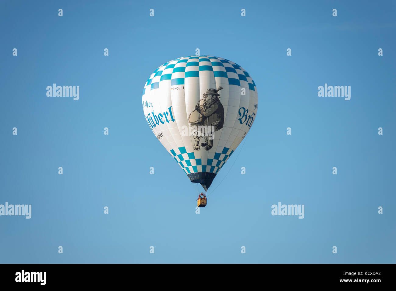 Blue and white hot-air balloon drivers with lettering Bräustüberl and ...
