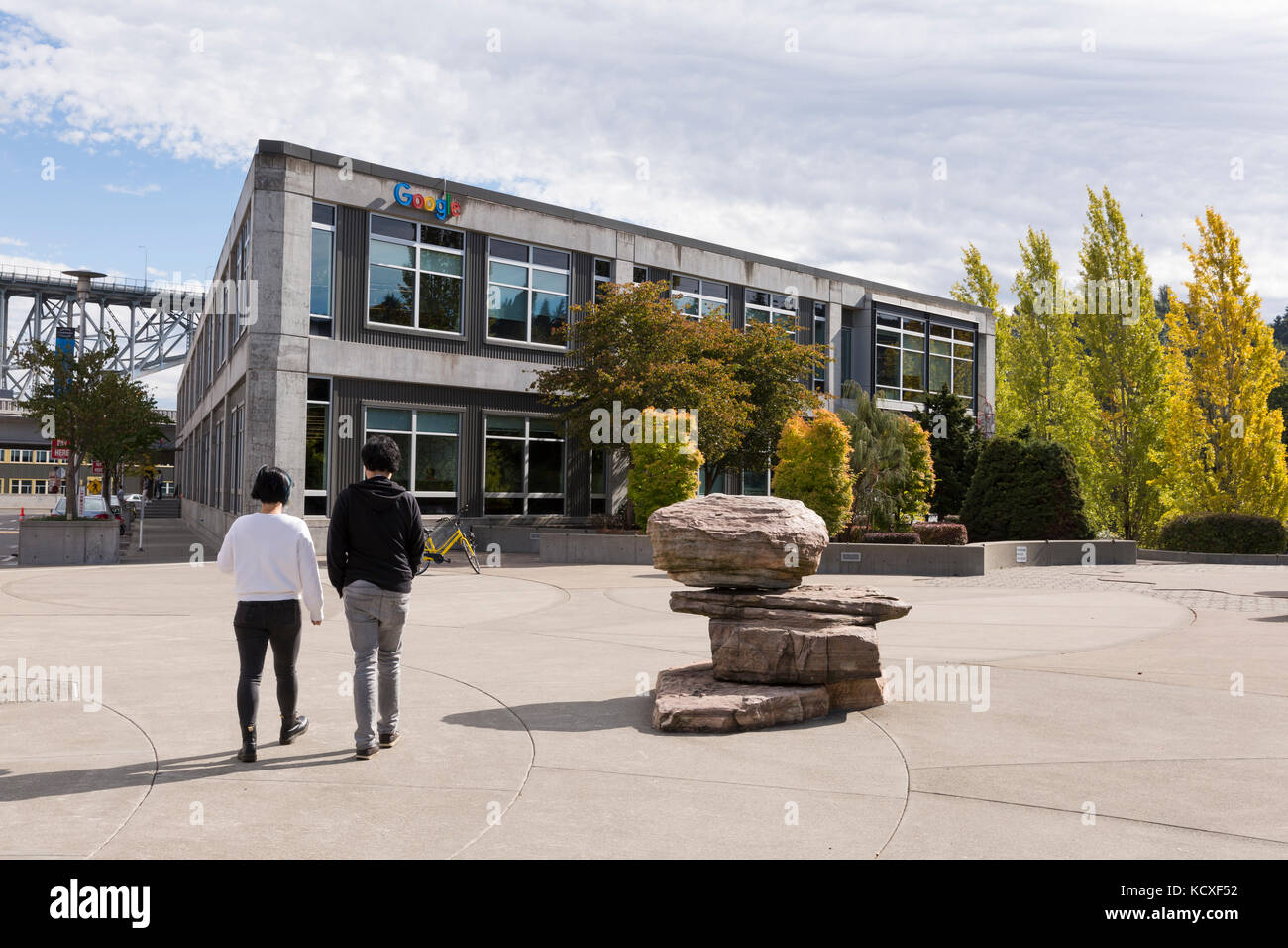Seattle, Washington: Couple walking in Evanston Plaza at Google Seattle ...