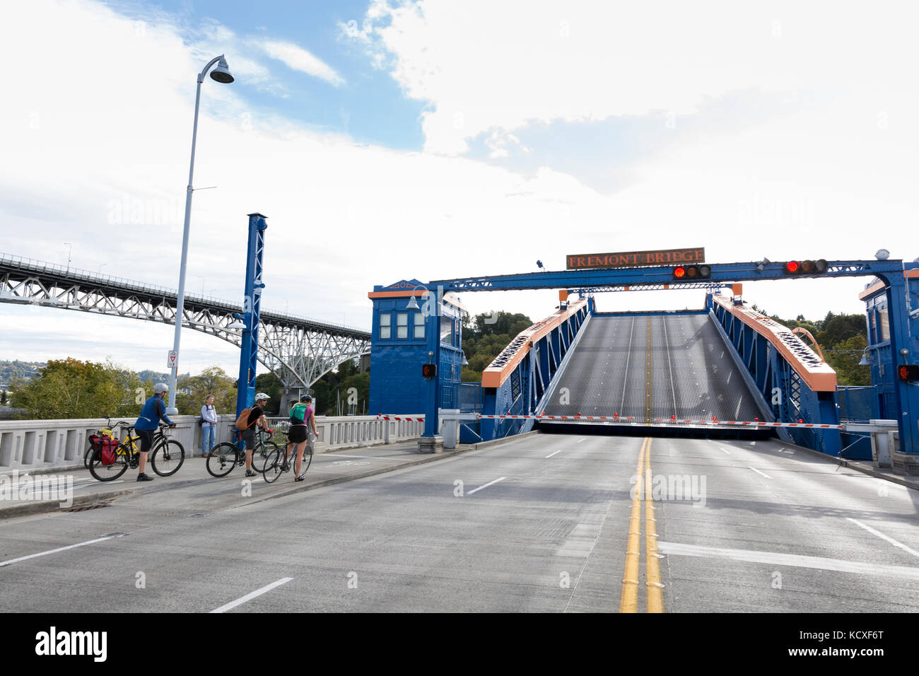 Seattle, Washington: Cyclists and pedestrians wait as the Fremont ...