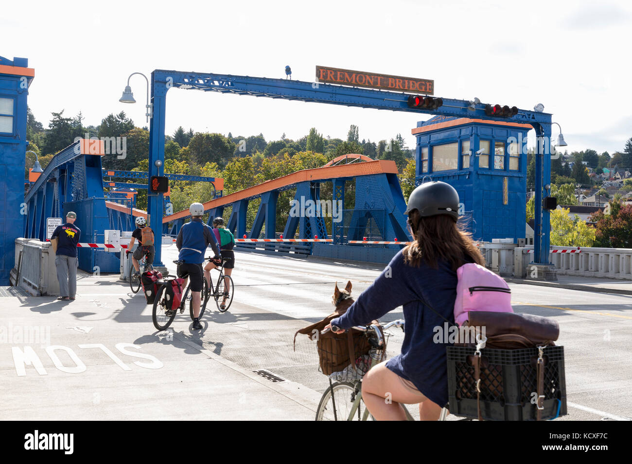 Seattle, Washington: Cyclists and pedestrians wait as the Fremont ...