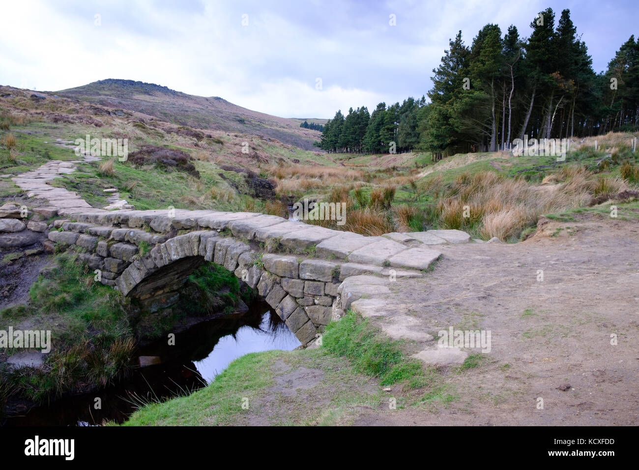 Packhorse bridge over Burbage Brook, below Carl Wark, Peak District, UK ...