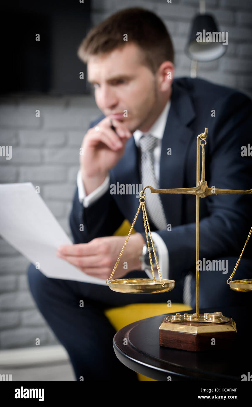 Weight scale of justice, lawyer in background. lawyer document ...