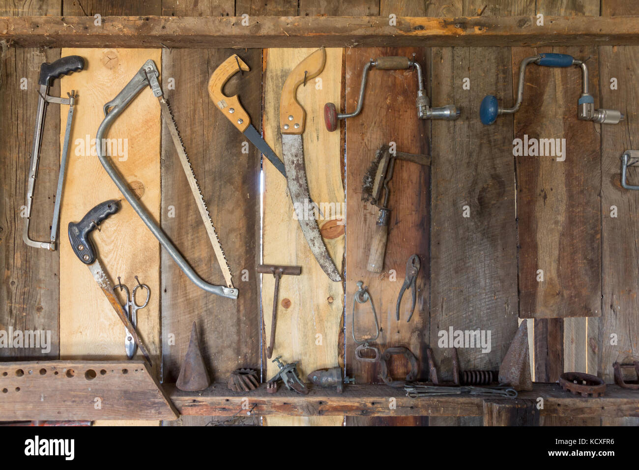 Old tools hanging on nails in a historic barn at the Schweiger Ranch ...