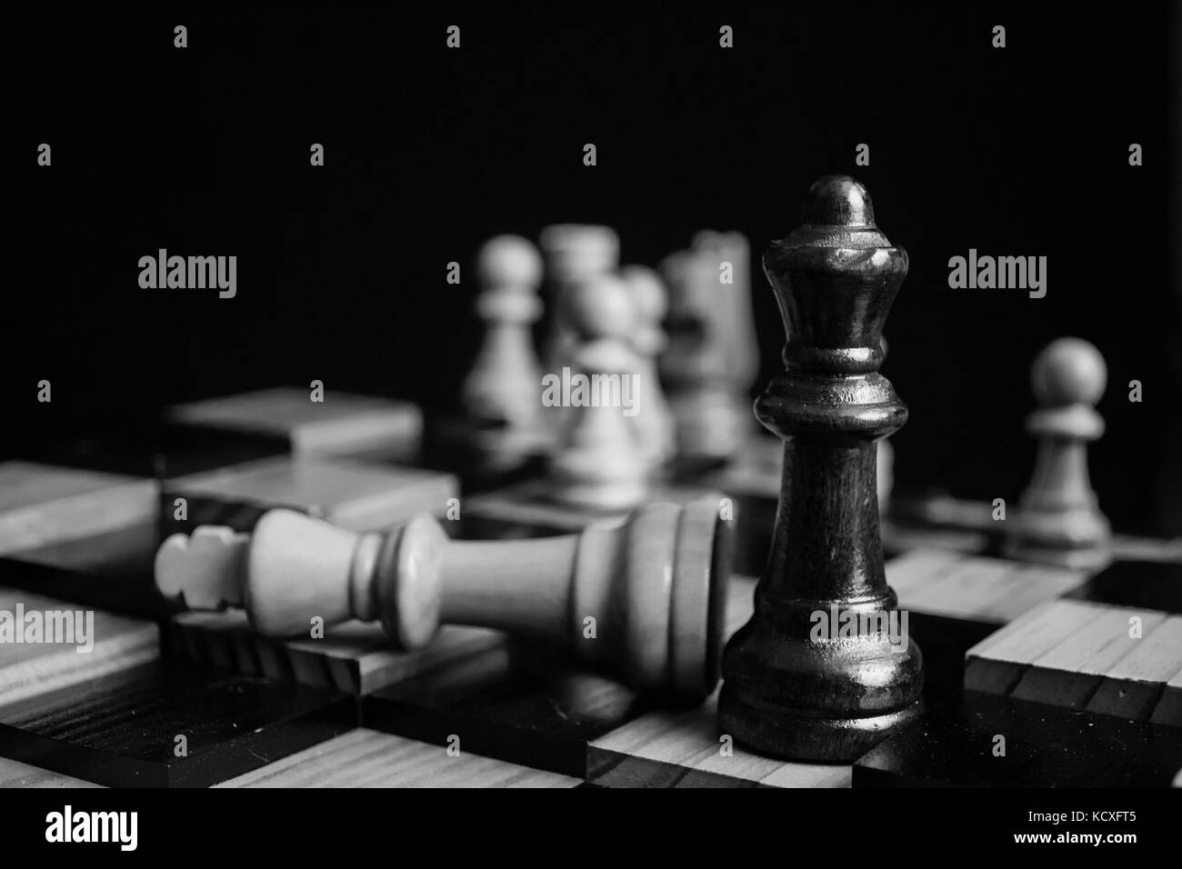 Low light photo of chess pieces and board Stock Photo - Alamy
