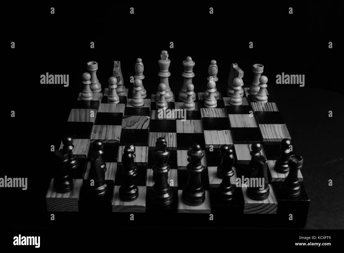 Low light photo of chess pieces and board Stock Photo - Alamy