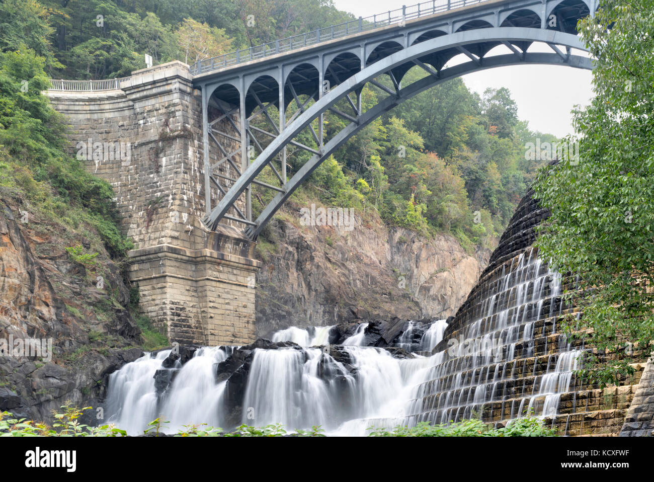 A dam in New York makes both a man made and natural waterfall under an ...