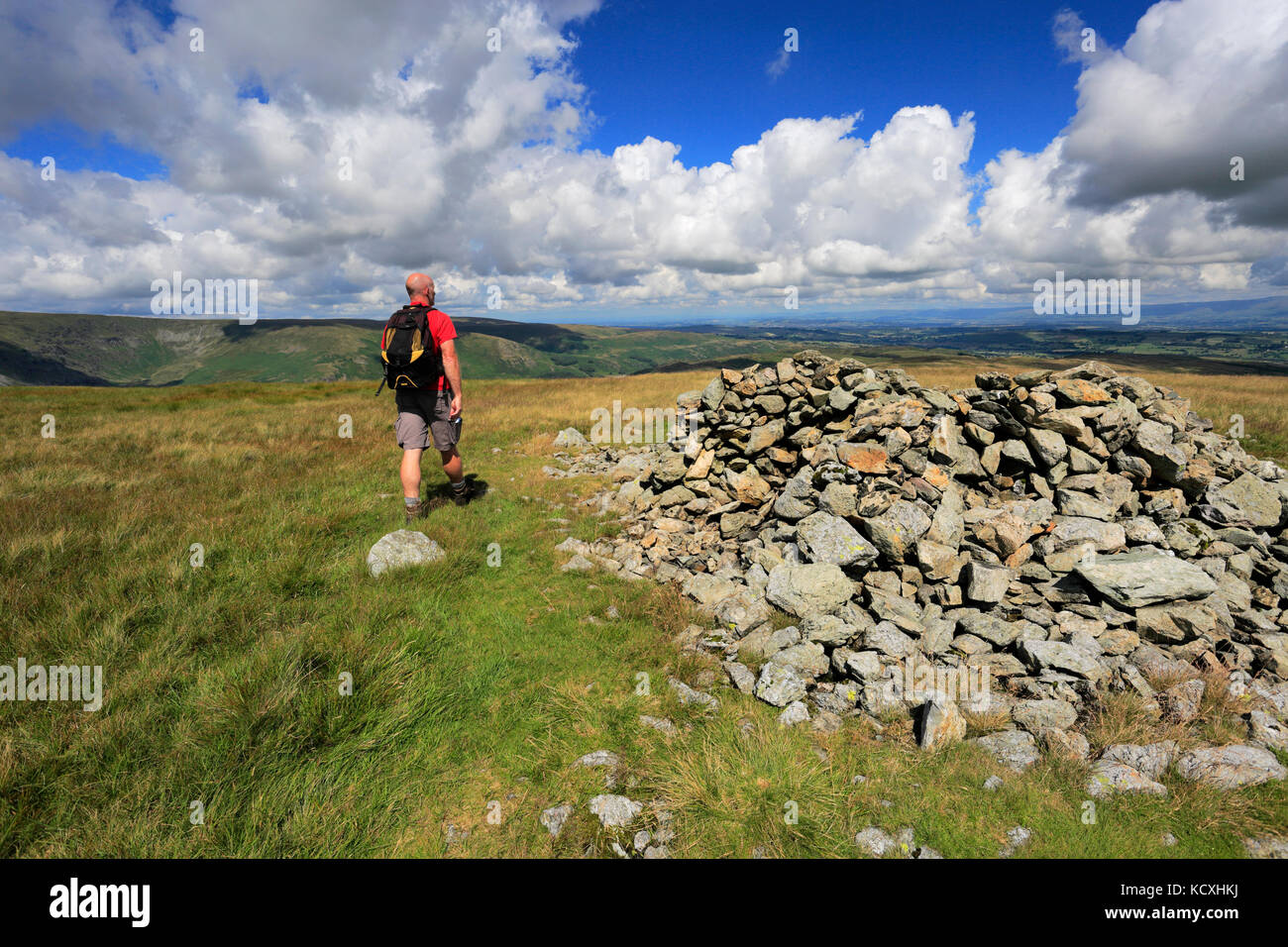 Walker at the summit of Selside fell, Lake District National Park ...