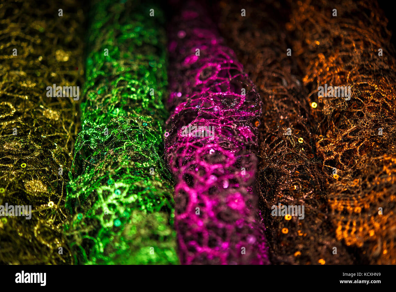 Stack of fabric glitter cloth rolls Stock Photo - Alamy