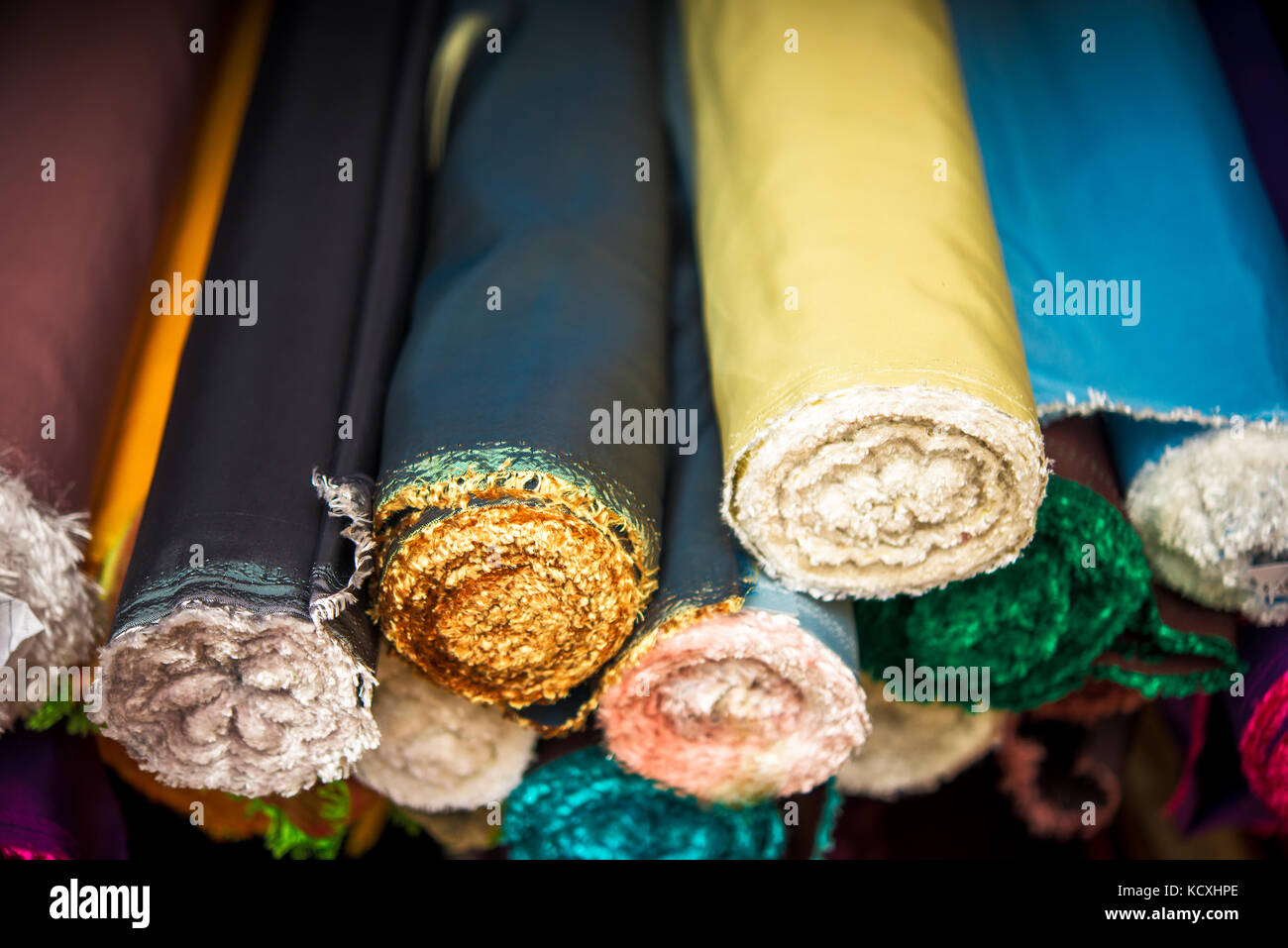 Stack of fabric colorful cloth rolls Stock Photo - Alamy