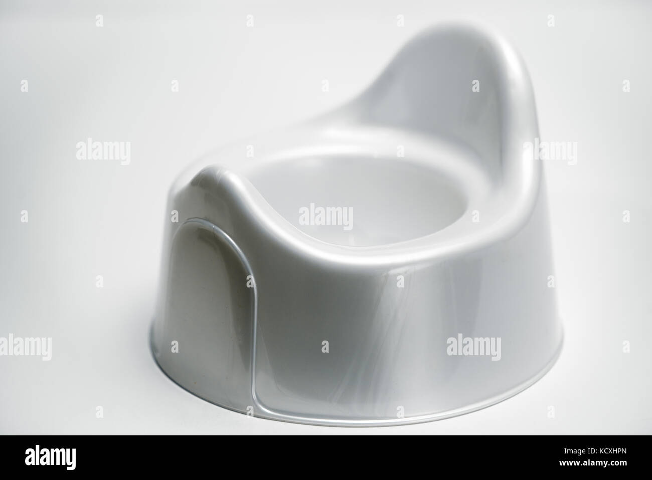 Kids children pee pot white Stock Photo - Alamy