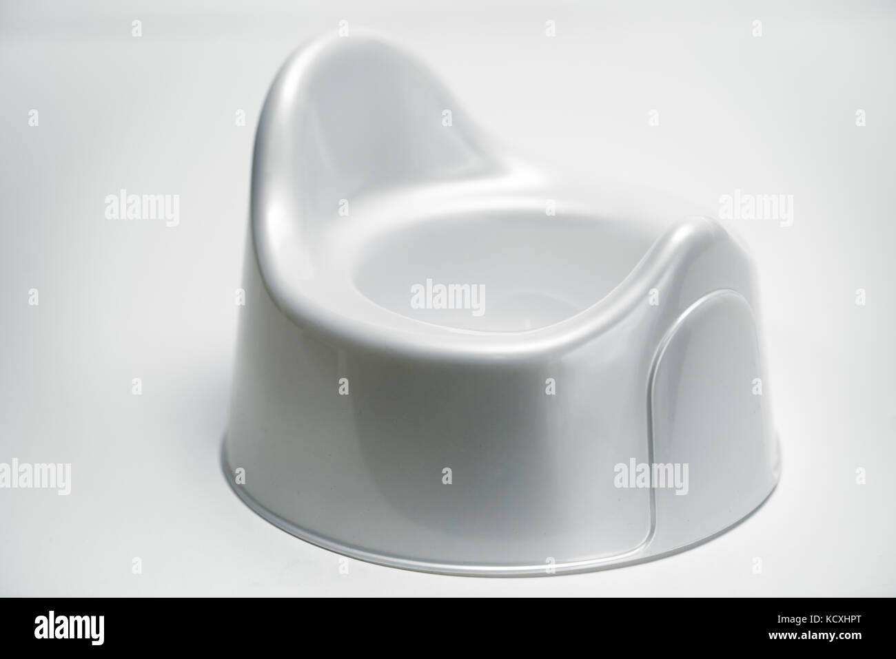 Kids children pee pot white Stock Photo - Alamy