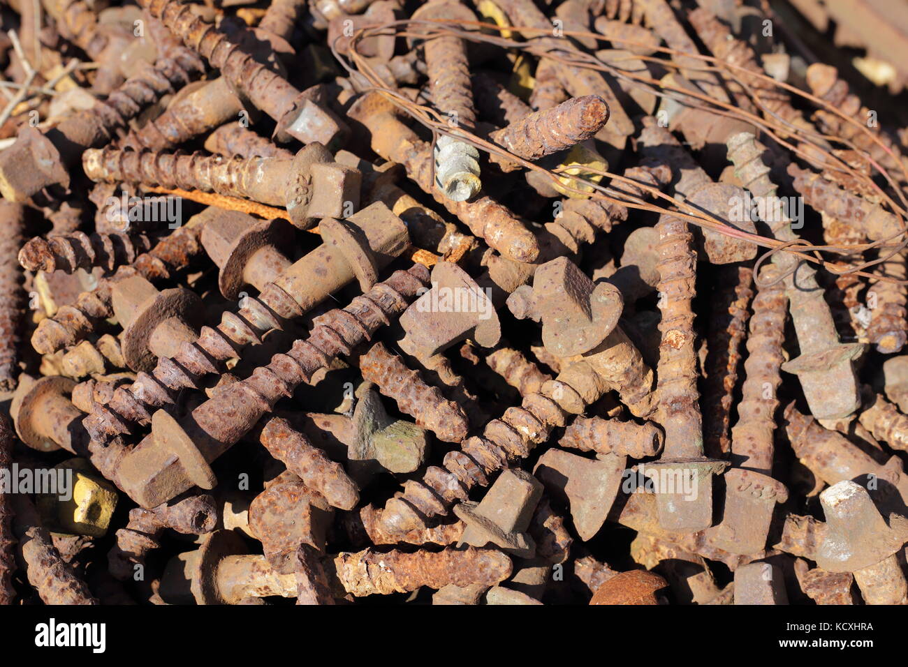 Old rusty rail iron screws background Stock Photo - Alamy