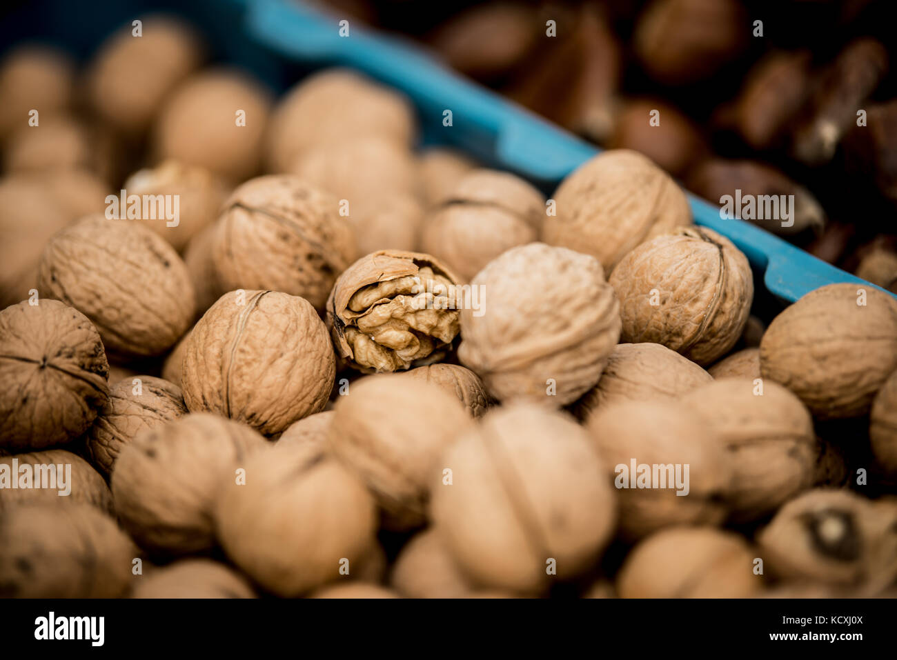 pile of walnuts in a basket on a market Stock Photo - Alamy