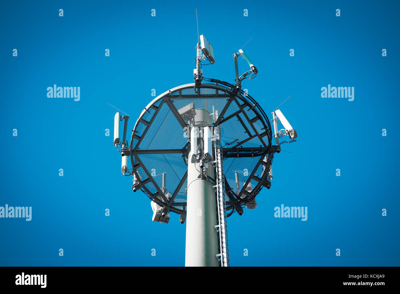 Cell phone cellular transmission tower blue sky Stock Photo - Alamy