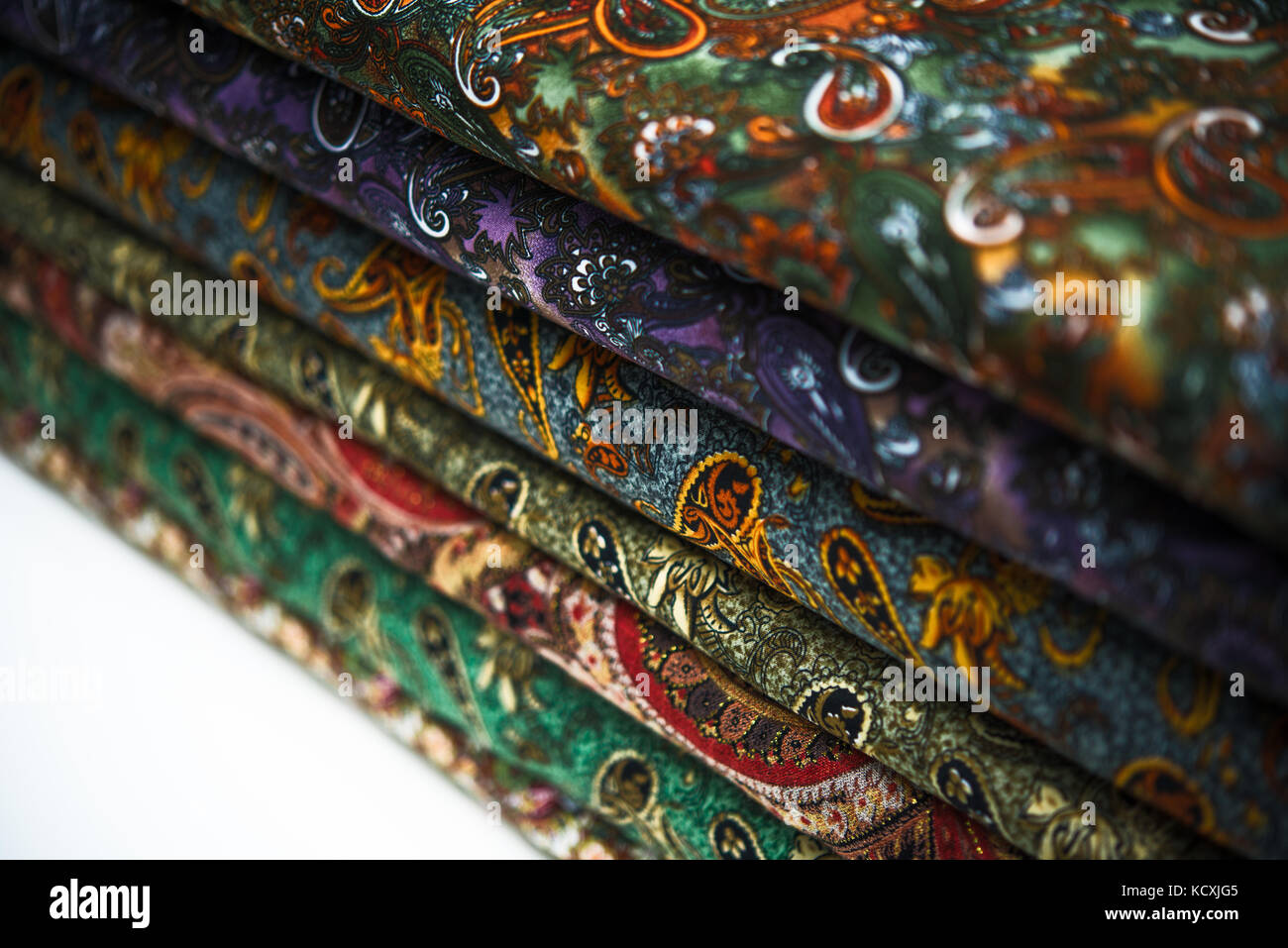 Stack of fabric paisley cloth rolls Stock Photo - Alamy