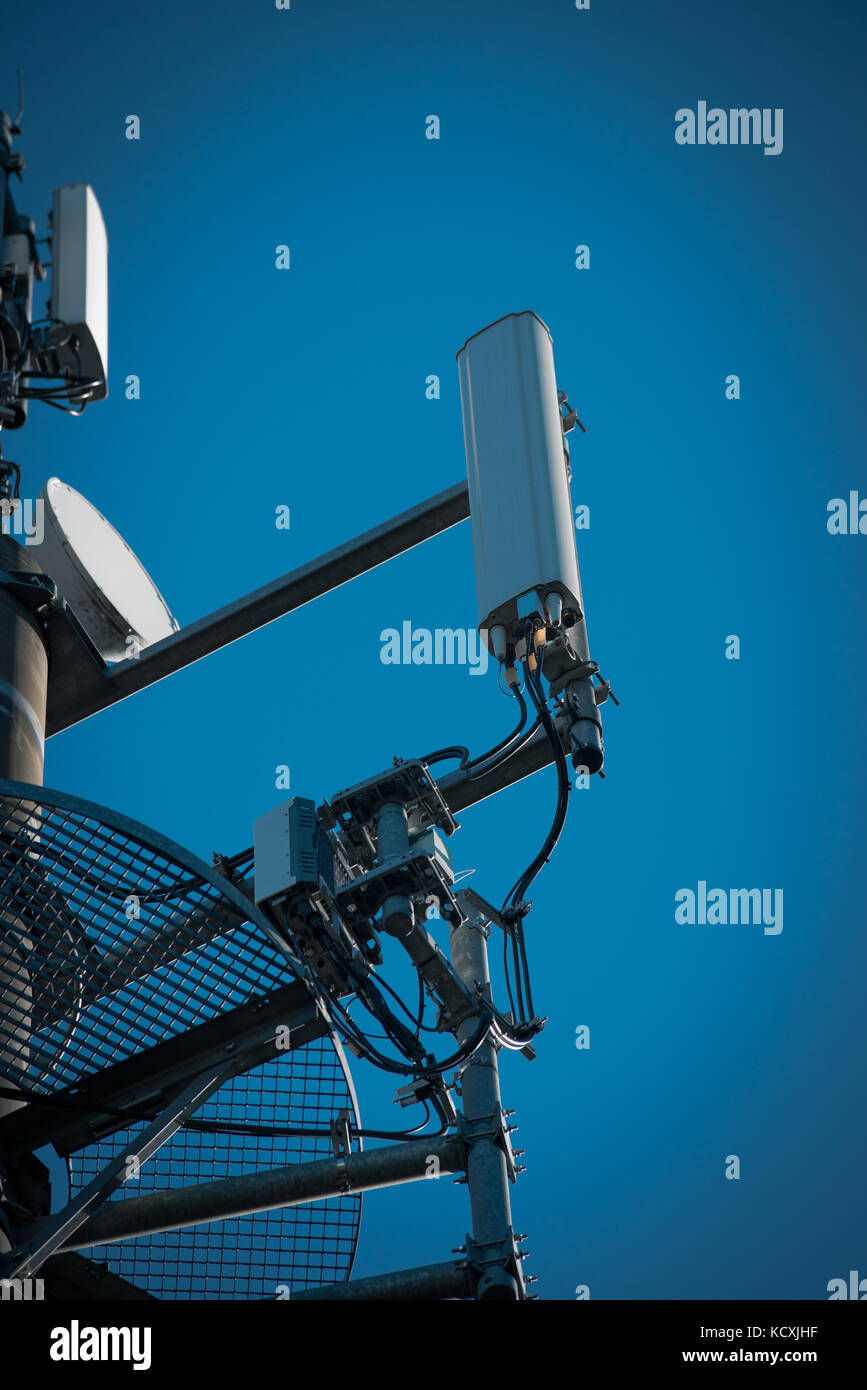Cell phone cellular transmission tower blue sky Stock Photo - Alamy