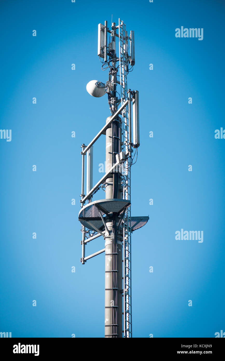 Cell phone cellular transmission tower blue sky Stock Photo - Alamy