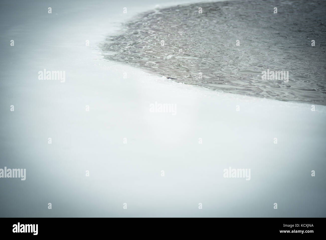 Frozen lake with water in winter Stock Photo - Alamy