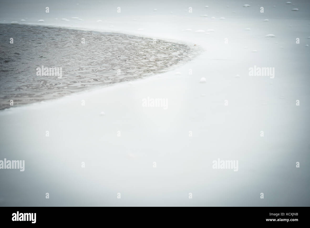 Frozen lake with water in winter Stock Photo - Alamy