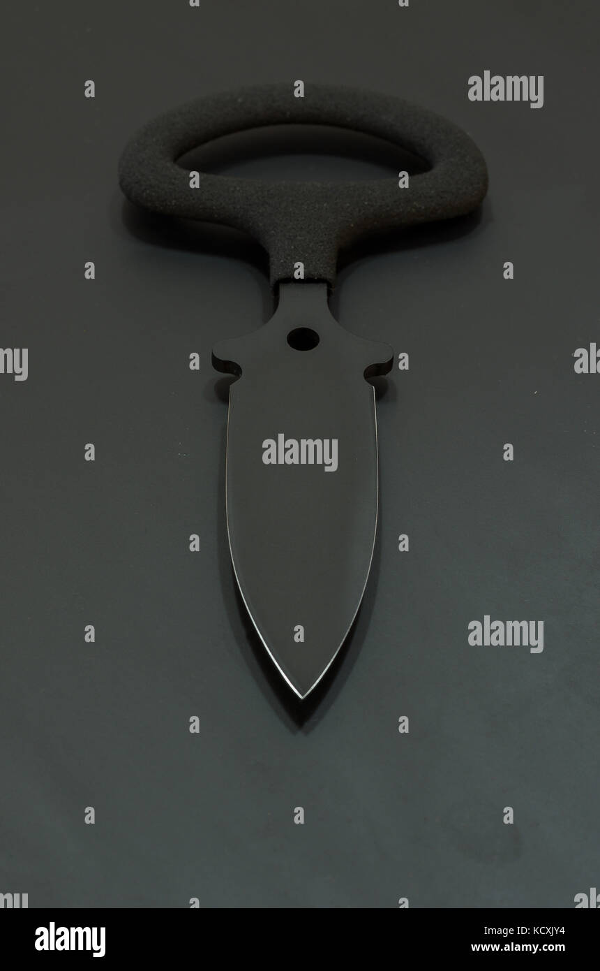 Black military composition. Vertical shot. Army knife Stock Photo - Alamy
