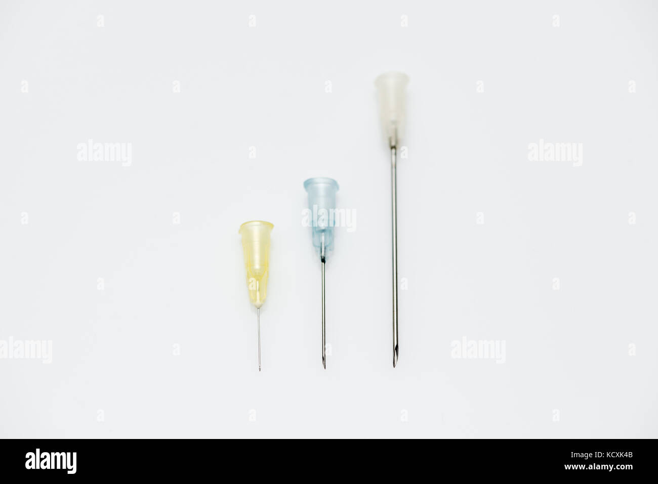Three needles cannulas macro Stock Photo - Alamy