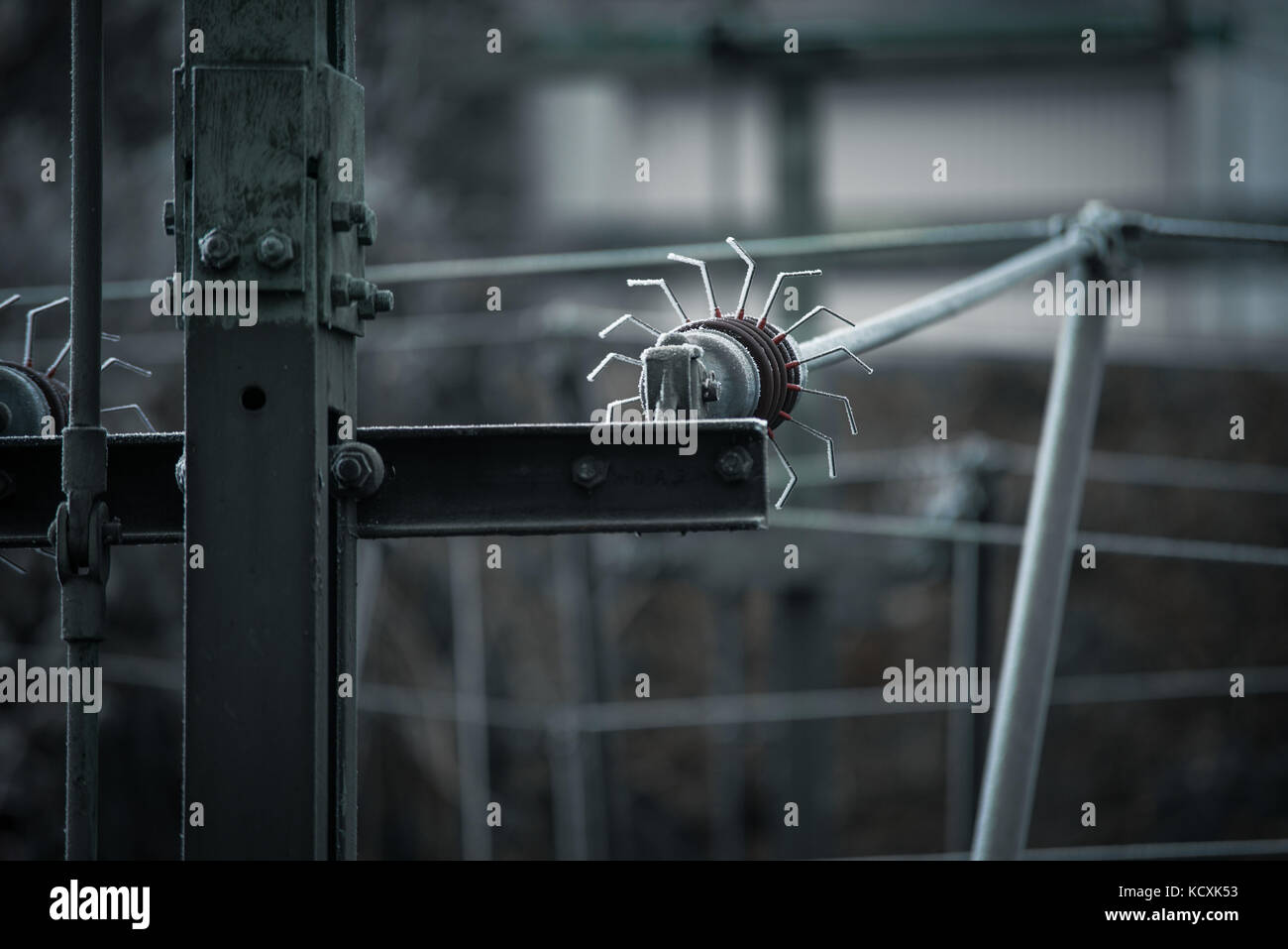 Electric railway supply post in winter frost Stock Photo - Alamy