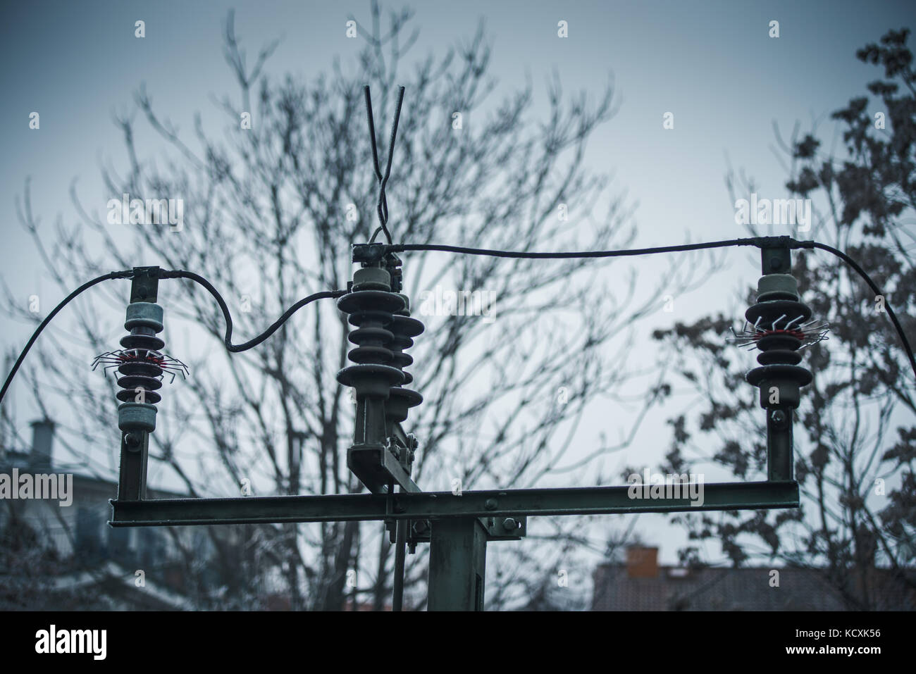 Electric railway supply post in winter frost Stock Photo - Alamy