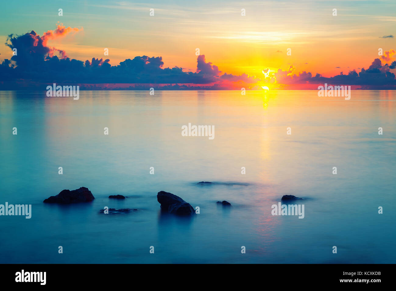 Sunrise over ocean Stock Photo - Alamy