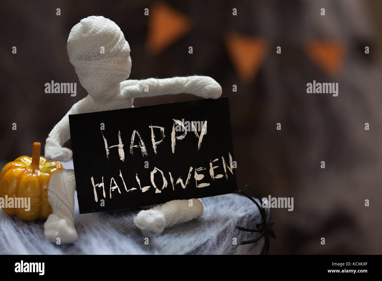 Cute funny mummy. Halloween decoration on table Stock Photo - Alamy