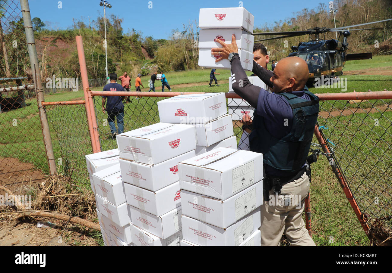 Residents of Castaner in the mountainous countryside of Puerto Rico ...