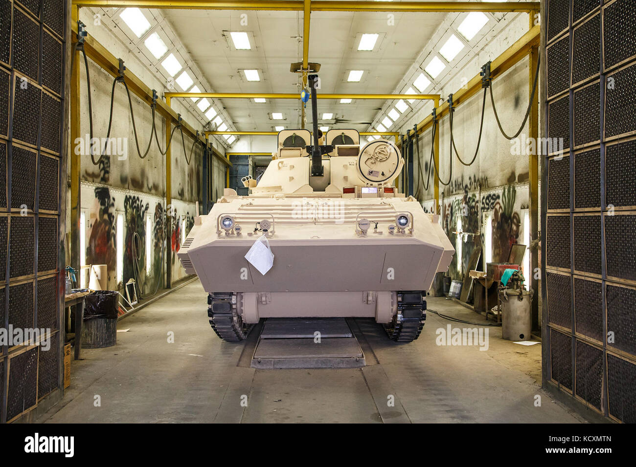 An M113A3/BMP-2 Opposing Forces Surrogate Vehicle stands in a paint ...