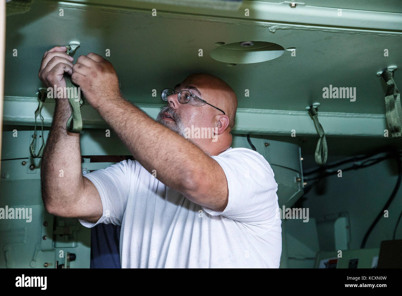 Henry Benefield installs straps in a M113A3/BMP-2 Opposing Forces ...